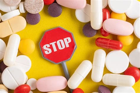 Premium Photo Pills And Stop Sign With Text Stop Conceptual Image For