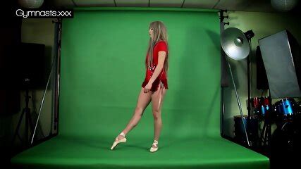 Red Dressed Gymnast Doing Spreads Red Dressed Gymnast Doing Spreads