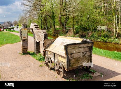 Historical Infromation And Wooden Sculpture At Watton Wharf Beside The