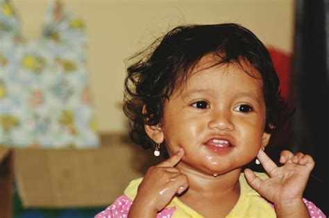 Premium Photo Close Up Of Innocent Girl At Home