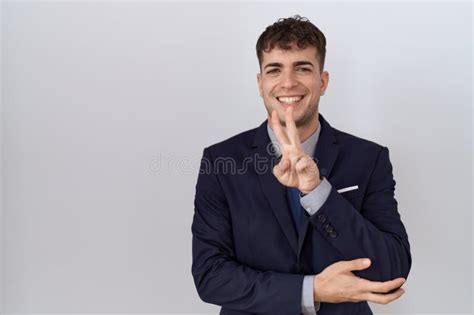 Young Hispanic Business Man Wearing Suit And Tie Smiling With Happy