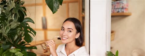 Premium Photo Beautiful Asian Girl Sitting In Cafe With Cup Of Coffee