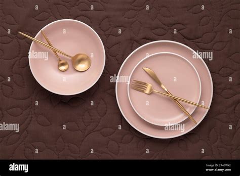 A Set Of Round Beige Plates Of Different Sizes On The Table Top View