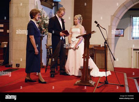 Bride And Groom Saying Wedding Vows During Marriage Ceremony Stock