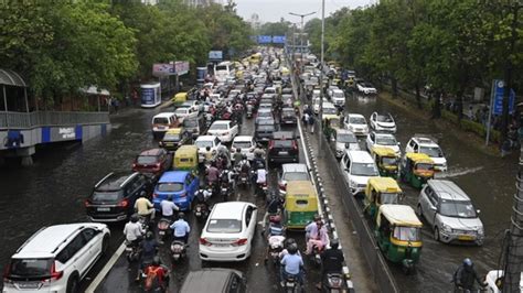 Heavy Rain Causes Waterlogging Traffic Woes In Delhi Ncr See Pics