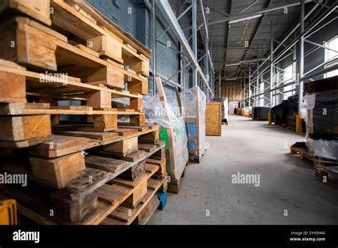 Warehouse Interior With Stacked Wooden Pallets Wrapped Goods And