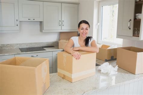 Premium Photo Smiling Woman Unpacking