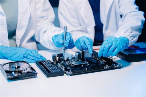 The Technician Is Putting The Cpu On The Socket Of The Computer Motherboard Electronic