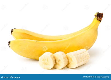 Two Ripe Bananas And Cut A Piece Of Peeled Banana On A White Isolated