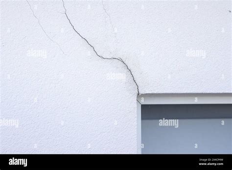 Detail Of A Crack In The Facade Cladding Near The Window Lintel Area