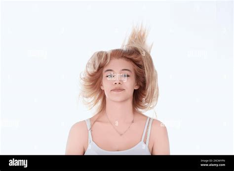 Young Woman With Beautiful Long Blonde Hair Joyfully Tosses Her Head