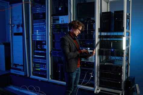 Premium Photo It Technician Using Digital Tablet While Working In