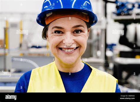 Mature Engineer Woman Working Inside Robotic Factory Business Industry Technology Concept