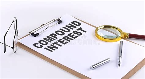 Compound Interest Text Written On A Notebook On Chart And Diagram Stock