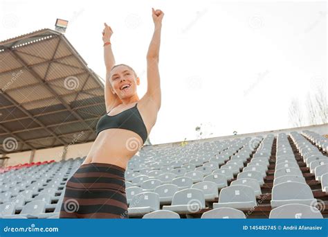 Beautiful Caucasian Girl Athlete Raised Her Hands Up As A Winner Stock