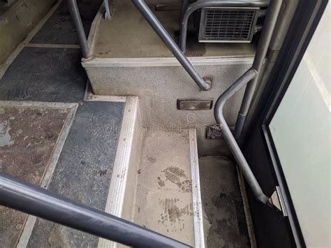 Old And Dirty Bus Inside View Of The Stairs Leading To The Exit Stock