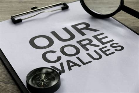 Core Values Guidance And Ethical Scrutiny Concept With Clipboard Compass And Magnifying Glass