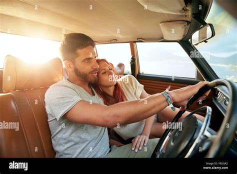 Romantic Young Couple In Their Car Going On A Road Trip Young Man