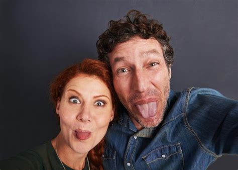 Premium Photo Slightly Goofy Portrait Of A Happy Young Couple Pulling