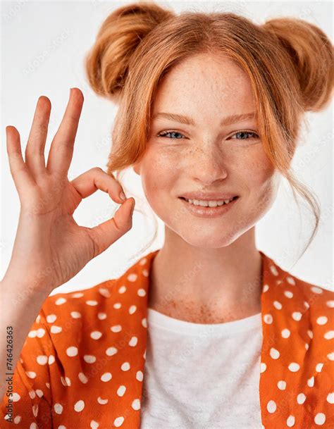 Beautiful Freckled Redhead Woman Smiling Showing The Zero Ok Sign