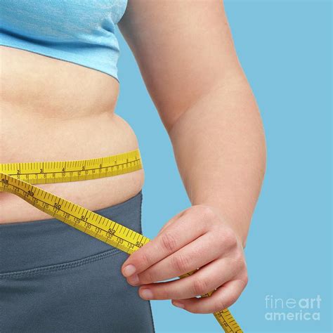 Overweight Woman Measuring Waist Photograph By Science Photo Library