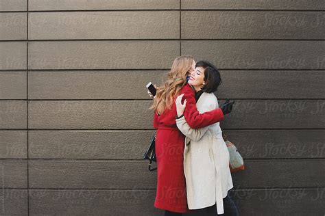 Young Women Hugging On The Street By Stocksy Contributor Lauren Lee