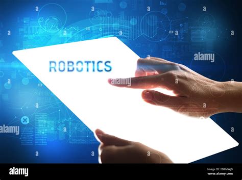 hand holdig futuristic tablet with robotics inscription new technology