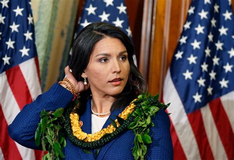 Photo Tulsi Gabbard Pulling Her Hair Back Away From Her Face