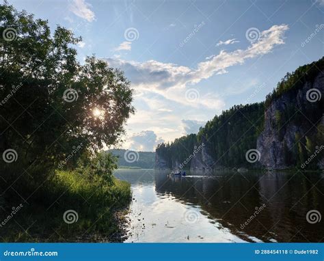 Beautiful Summer Landscape With River And Blue Sky With Clouds At