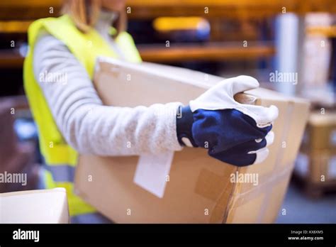 Female Warehouse Worker Loading Boxes Stock Photo Alamy