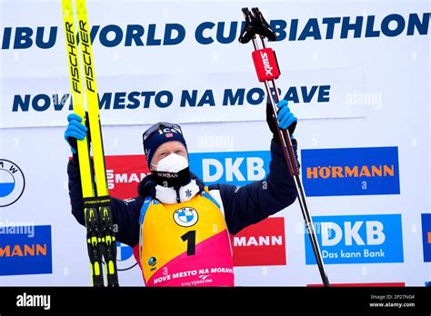 First Place Norways Johannes Thingnes Boe Poses On The Podium After