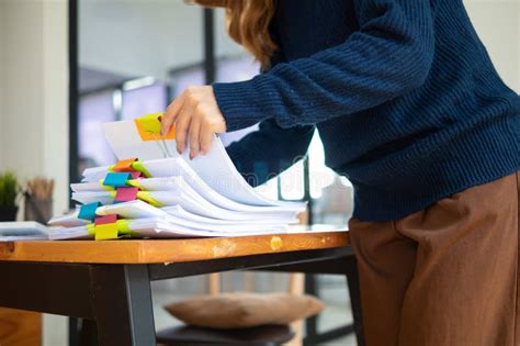 Businesswoman Hands Working On Stacks Of Paper Documents To Search And