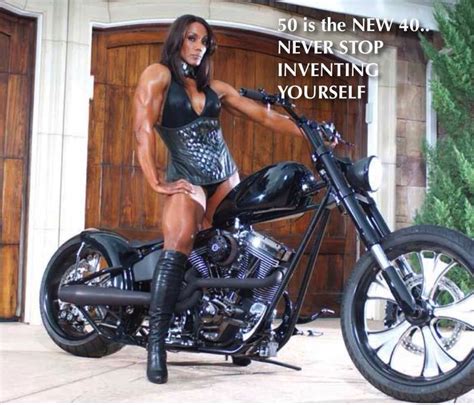 A Woman Standing On Top Of A Motorcycle In Front Of A Garage With The Caption Is The New