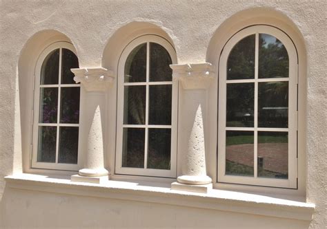 Elegant Arched Windows On White Stucco Building