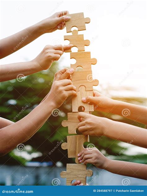 Puzzle In Hand Teamwork Together Communication Puzzle Piece Teamwork
