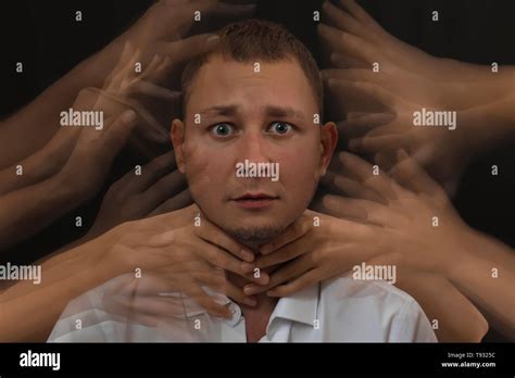 Many Hands Stretched To Man On Dark Background Panic Attack Stock