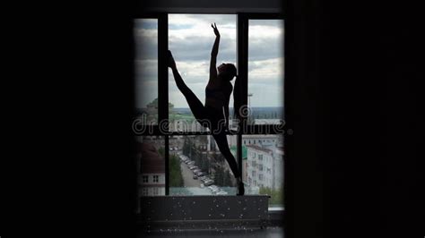 Stranger Peeping Like Beautiful Girl Doing Stretch Of Her Legs Stock