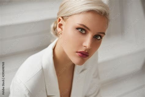 A Fashionable Young Woman With Perfect Blond Hair And Perfect Trendy