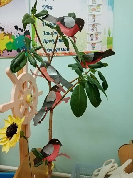 Аппликация Снегири на дереве в разновозрастной старшей группе
