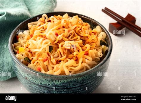 Instant Soba Noodles With Carrot Scallions And A Sauce A Close Up With Chopsticks Stock Photo