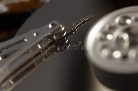 Hard Disk Drive Close Up Of Reading Head Scanning Platter For Data