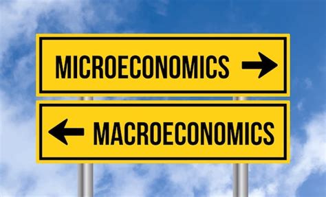 Premium Photo Microeconomics Or Macroeconomics Road Sign On Cloudy