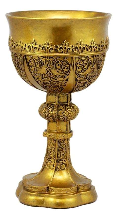 An Ornately Decorated Gold Cup On A Stand