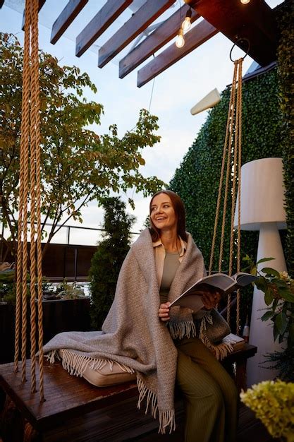 Premium Photo Young Woman Wrapped In Warm Blanket In Cozy Place