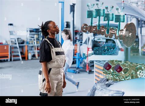 Experienced Worker In Repair Shop Using Holographic Augmented Reality
