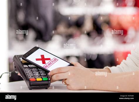 POS Terminal Payment Machine With Mobile Phone On Store Background Contactless Payment With