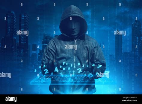 Hooded Man With Anonymous Mask Hacking System Online Security Stock