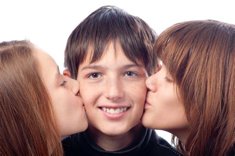 Two Pretty Girls Kissing Smiling Boy Stock Photo Image Of Portrait
