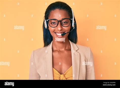 Young African American Woman Wearing Call Center Agent Headset Smiling