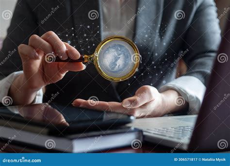 Manager Shows Global Network Through Magnifying Glass Stock Image